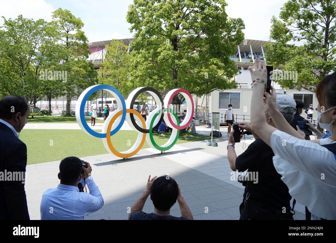 People pose with the Olympic Five-Ring Emblem at Japan Sport Olympic ...