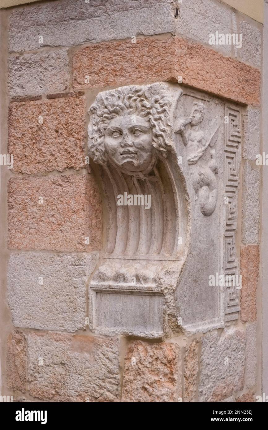 Roman symbol at a wall close to Porta Borsari, the remains of the Roman ...