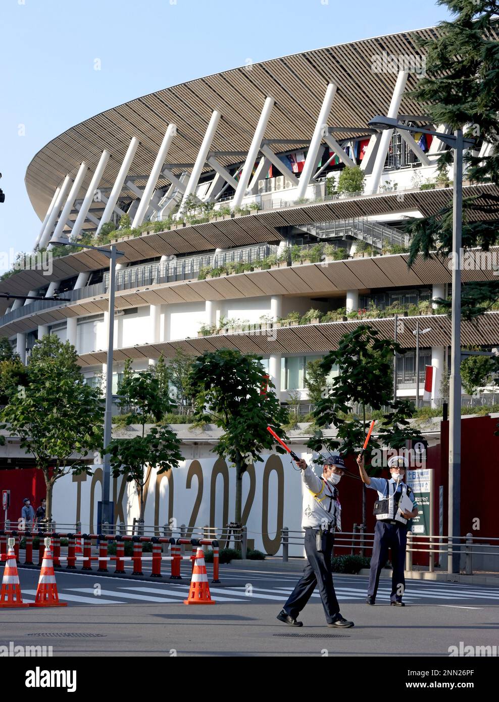 Traffic is regulated in front of National Stadium, a venue of Tokyo ...