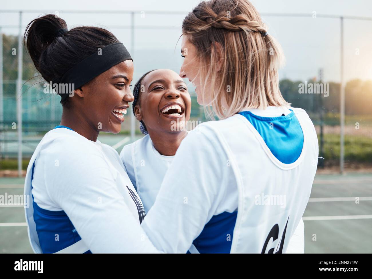 Hug, success or teamwork in netball training game or match with goals ...