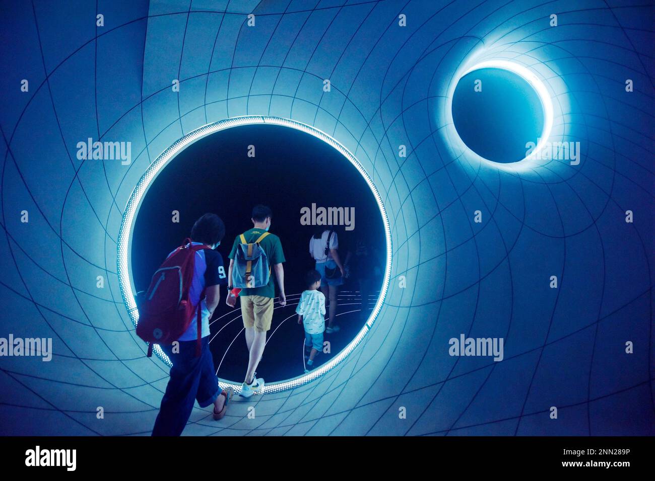 Visitors walk through a "Black Hole" at Shanghai Astrology Museum in ...