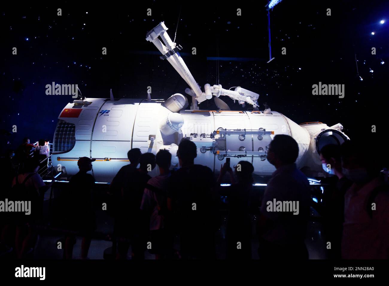 Visitors stop by the lifesize model of Tianhe core module of the ...