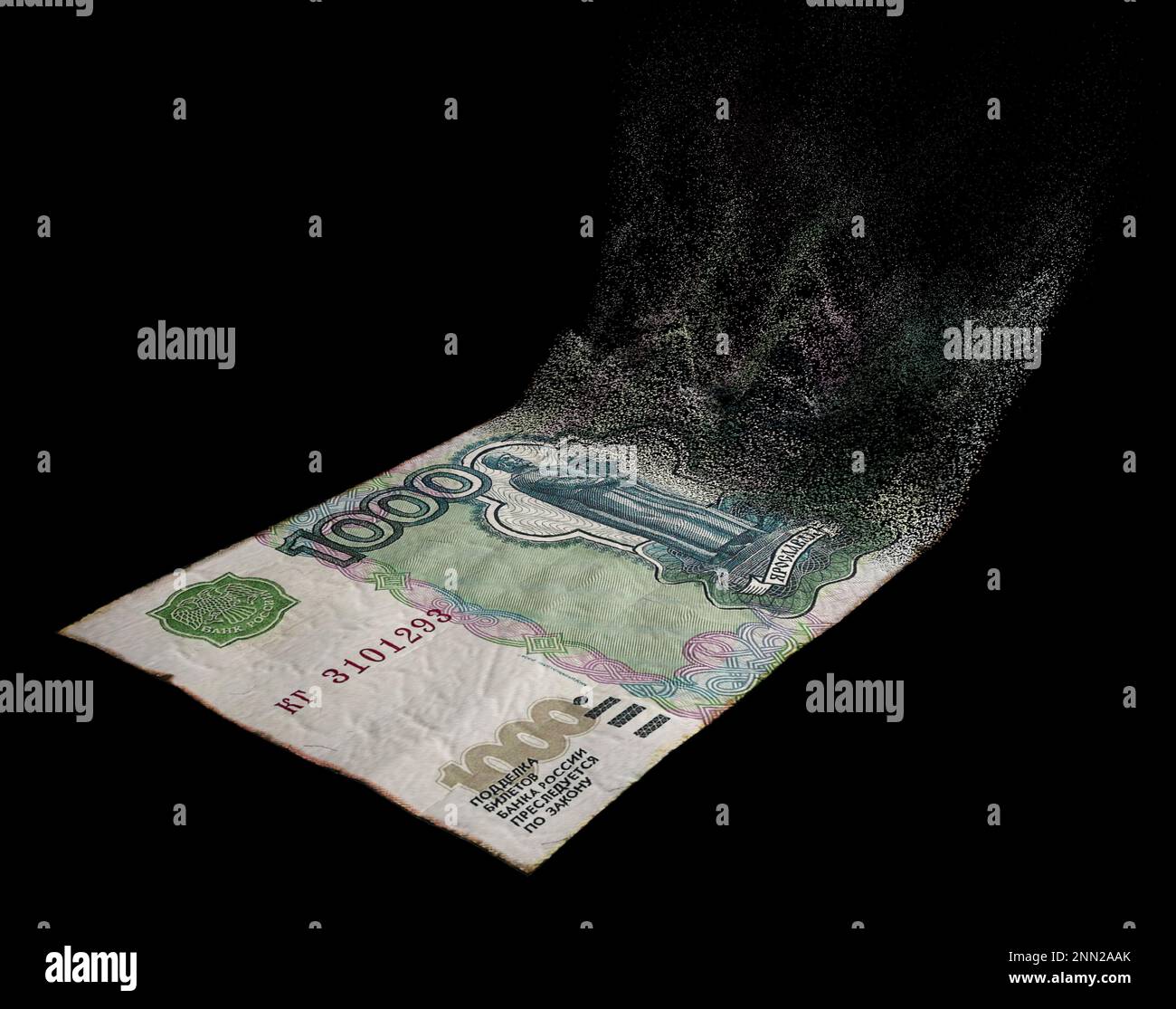 A concept image showing a half dissolved flat paper russian ruble bank ...