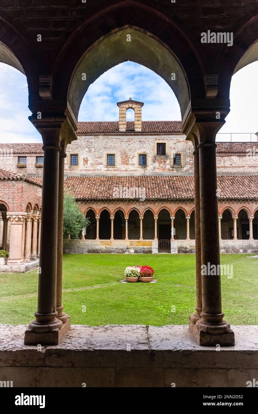 Columns, arches and backyard of the cloister of the church Basilica di ...