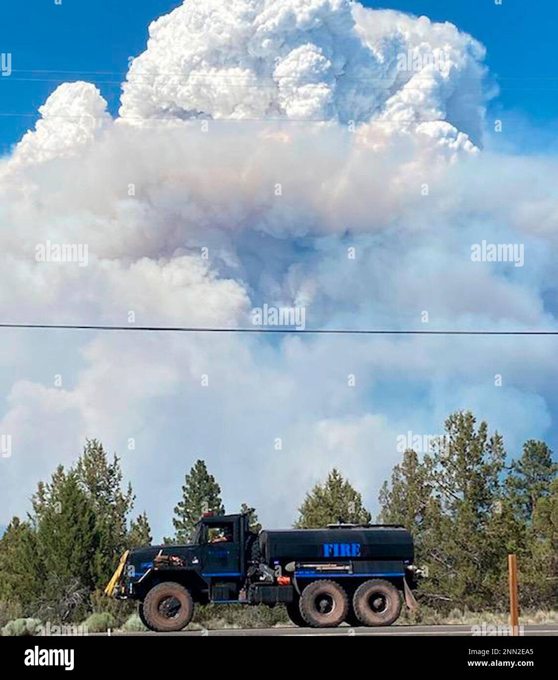 In this photo provided by the Bootleg Fire Incident Command, columns of ...