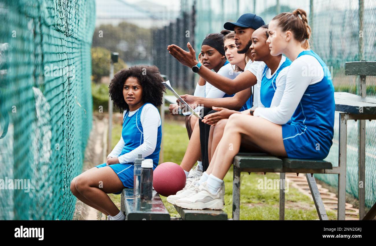 Sports, talking and coach with women at netball, training and watching ...