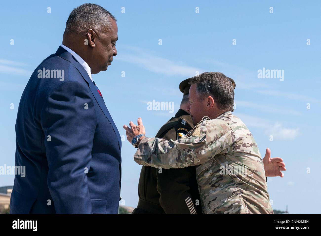 Joint Chiefs Chairman Gen. Mark Milley, center, hugs Gen. Scott Miller ...