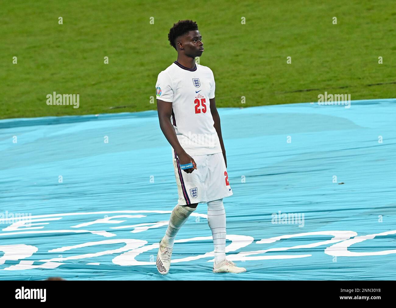 England's Bukayo Saka walks away after getting his medal during the ...