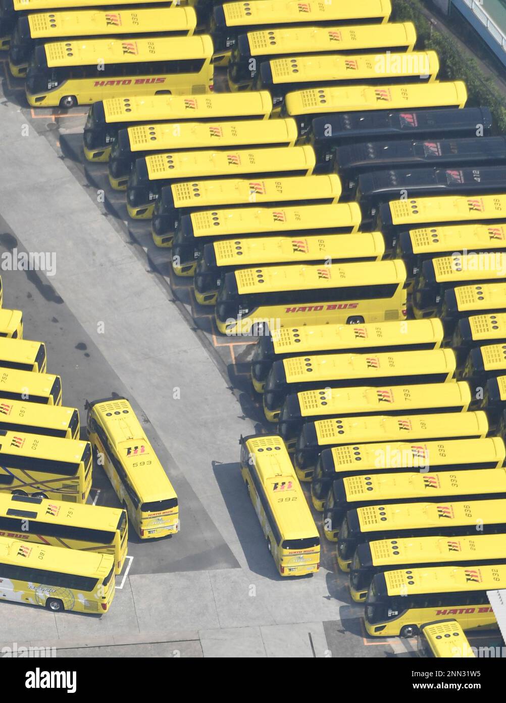 An aerial photo shows many vehicles of Hato Bus parking in Tokyo on ...