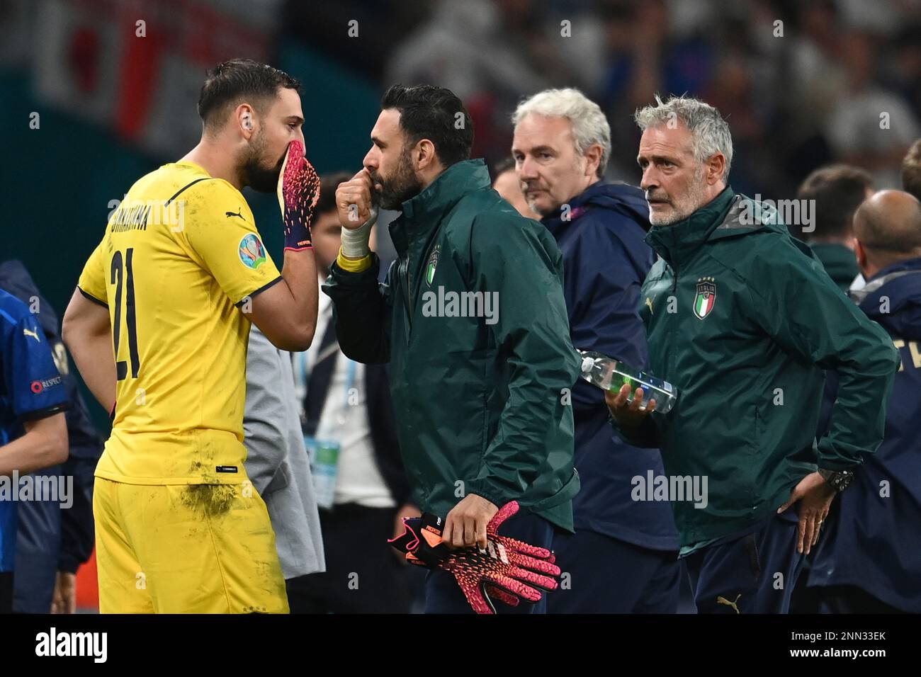 Italy's manager Roberto Mancini, left, speaks with his teammate before ...
