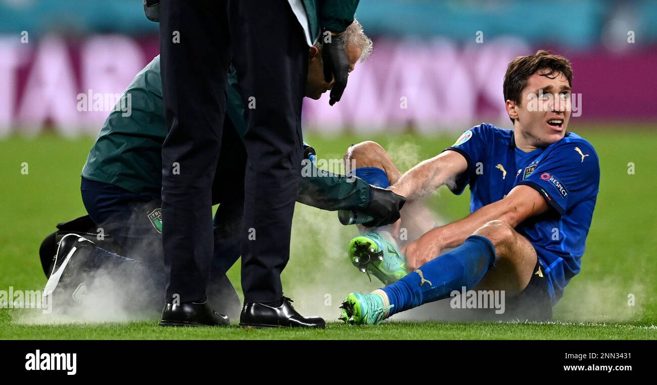 Italy's Federico Chiesa is treated for an injury during the Euro 2020 ...