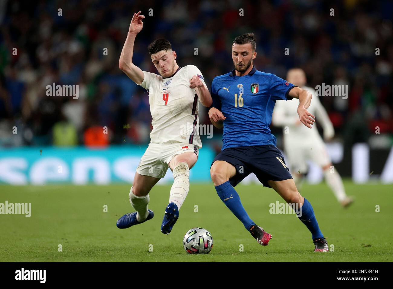 England's Declan Rice, left, vies for the ball with Italy's Bryan ...