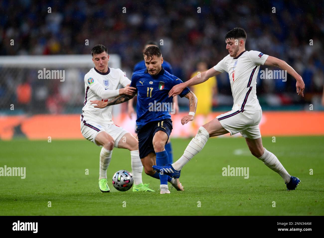 England's Mason Mount, left, and Declan Rice, right, try to stop Italy ...