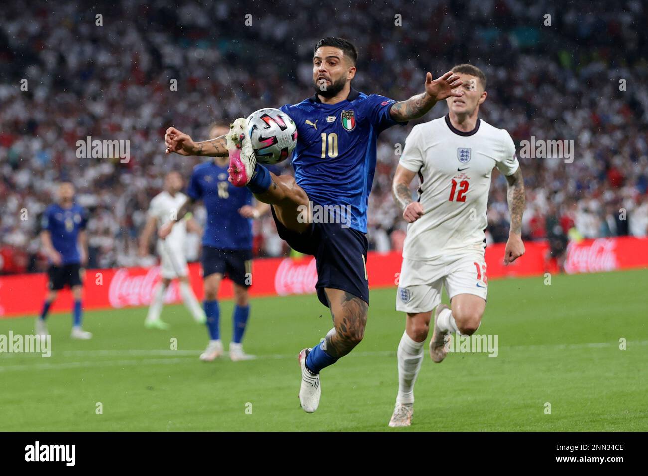 Italy's Lorenzo Insigne controls the ball in front of England's Kieran ...