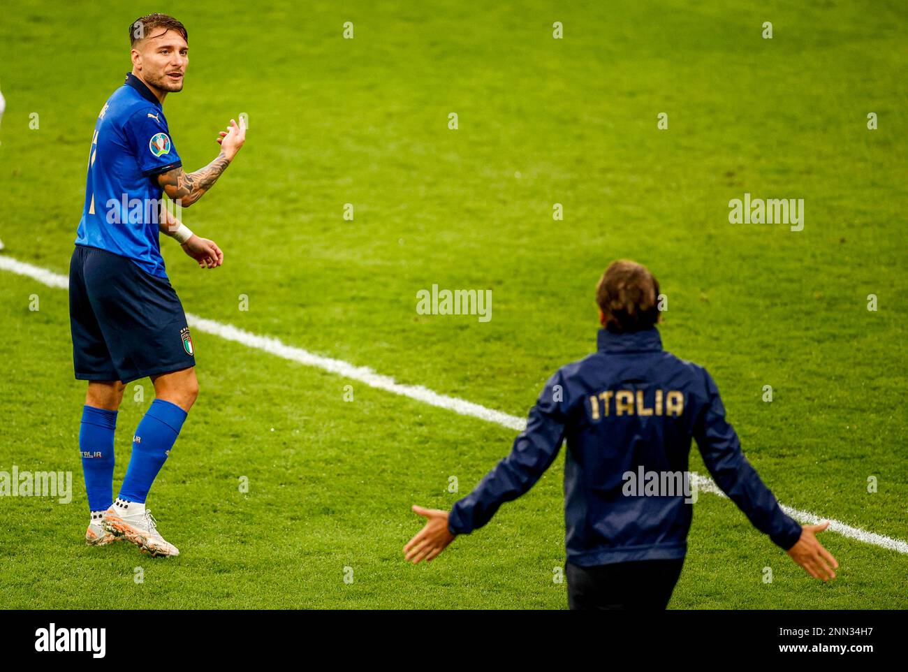 Italy's manager Roberto Mancini, right, gestures to Ciro Immobile ...