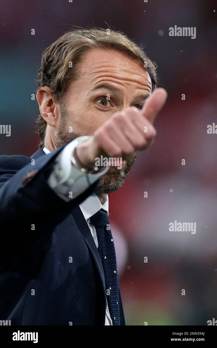 England's manager Gareth Southgate gestures as he walks on the pitch ...