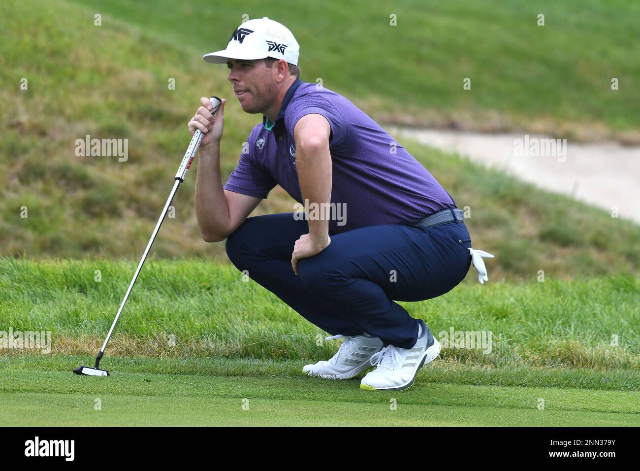 SILVIS, IL - JULY 10: Luke List lines up his putt on the #1 green ...