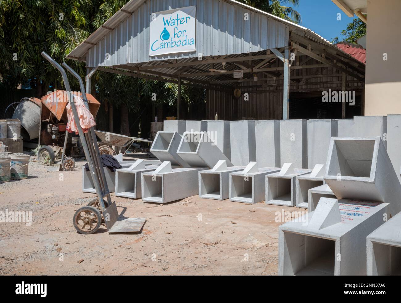 Biosand water filters awaiting finishing in the front yard of office ...