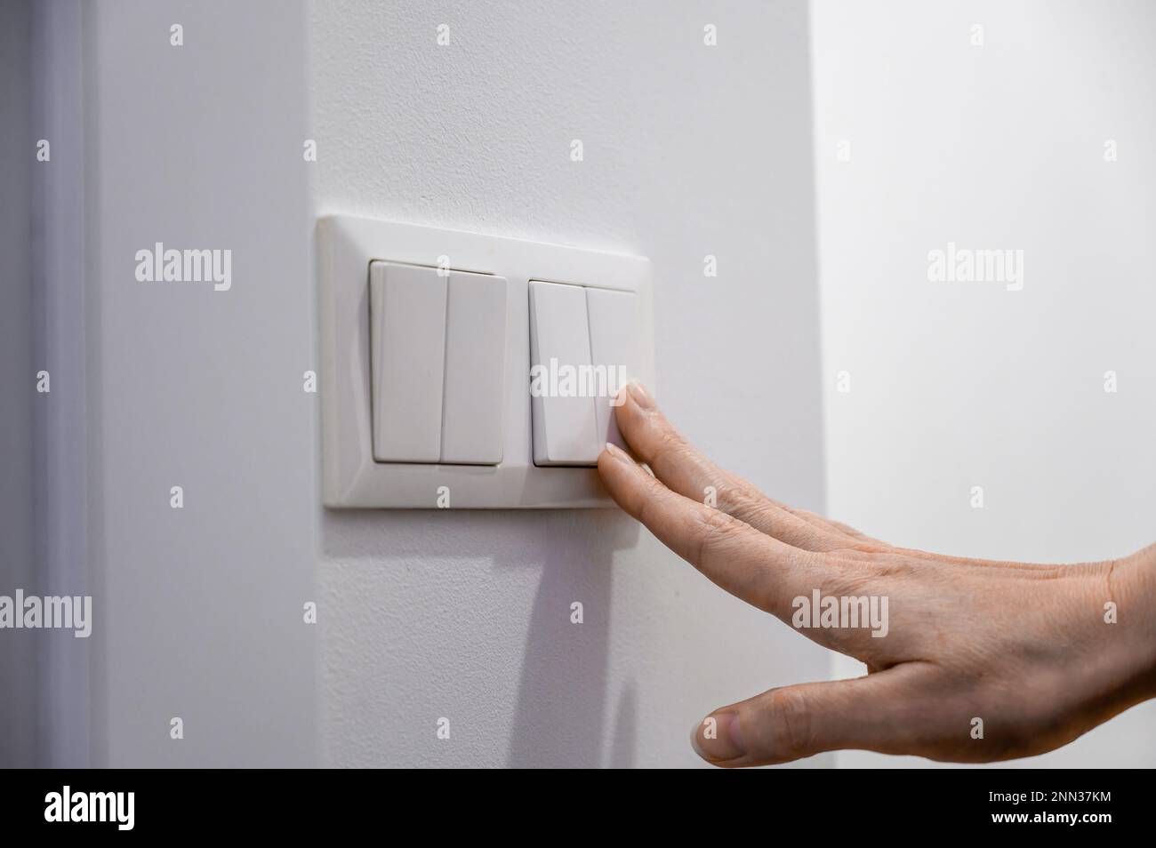 Light switch finger saving energy hi-res stock photography and images ...