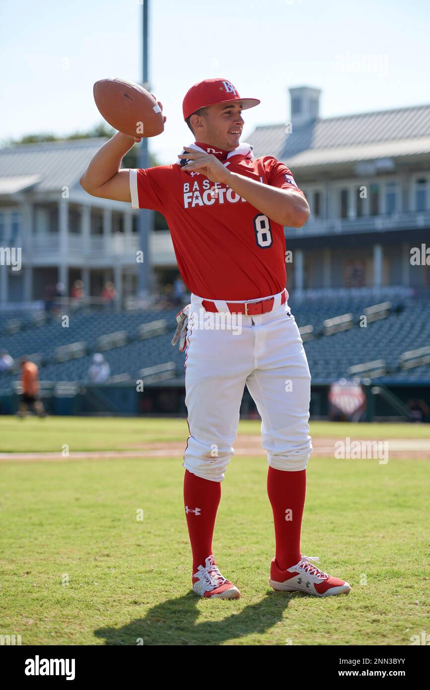 Alex Ulloa (8) throws a football before the Baseball Factory All-Star ...