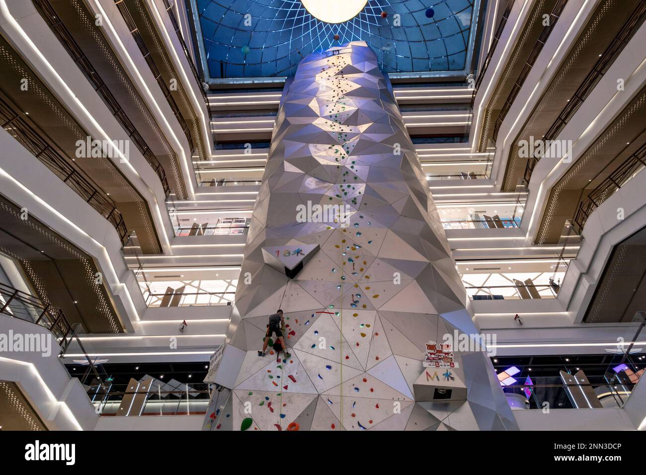 A man climbs the 55-meter-tall climbing wall, the world's tallest ...