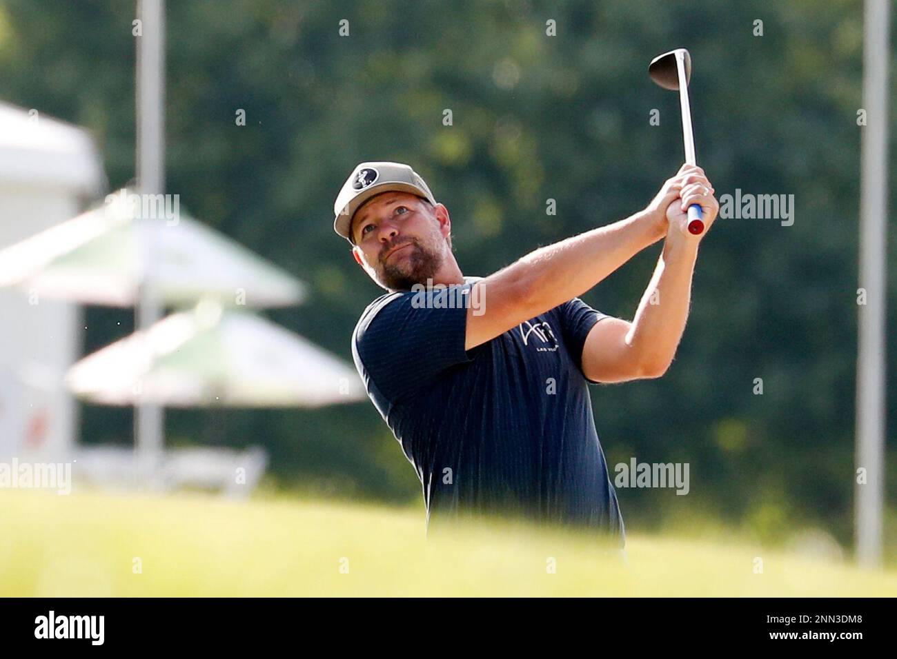 SILVIS, IL - JULY 09: PGA golfer Ryan Moore plays his second shot on ...