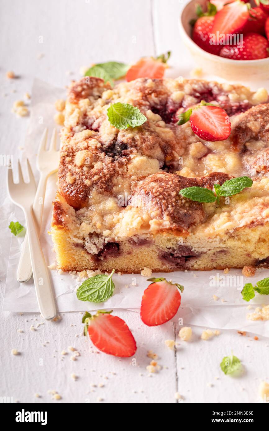 Sweet and homemade strawberry cake with caster sugar and berries ...