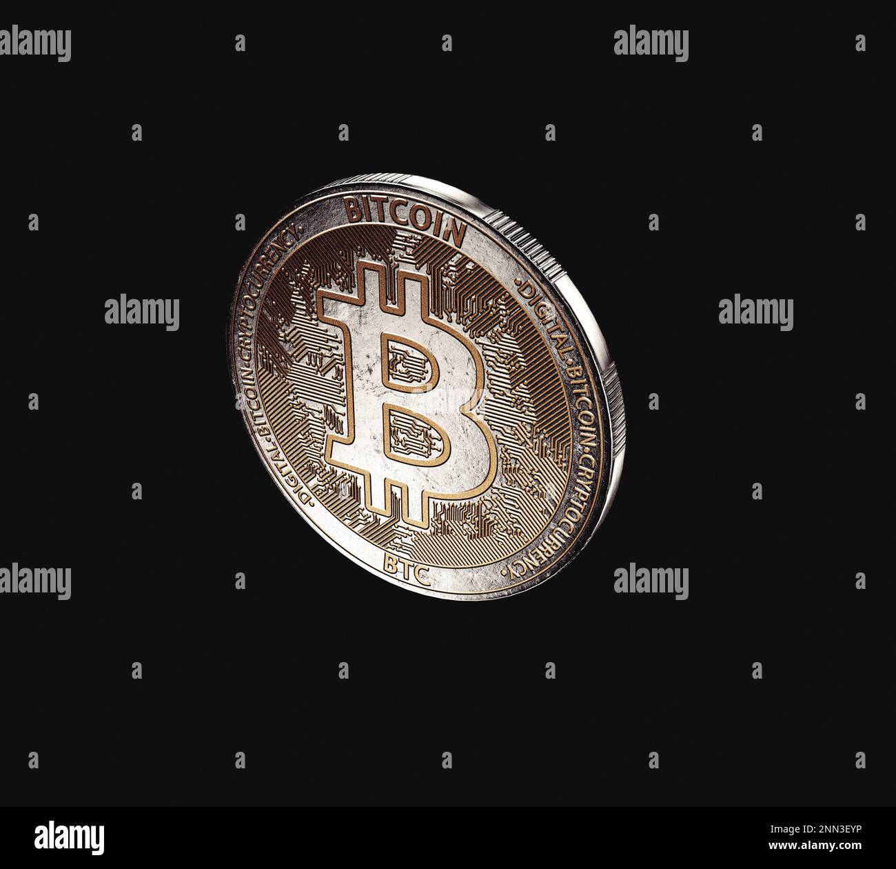A dimly lit physical bitcoin cryptocurrency in bronze and silver coin ...