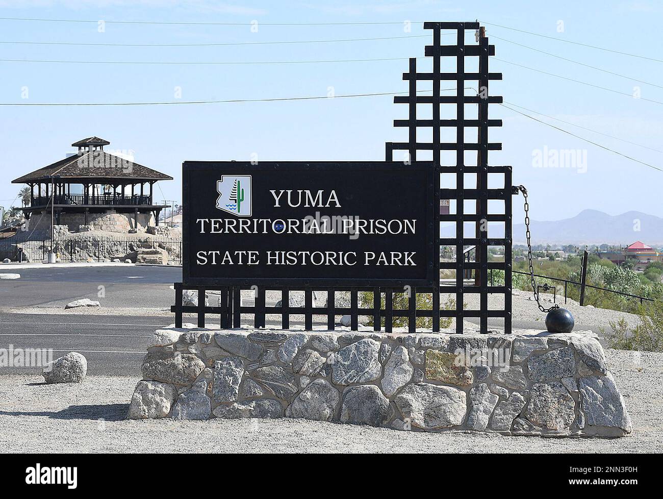 A sign that incorporates the prison cell steel bars and a ball and ...