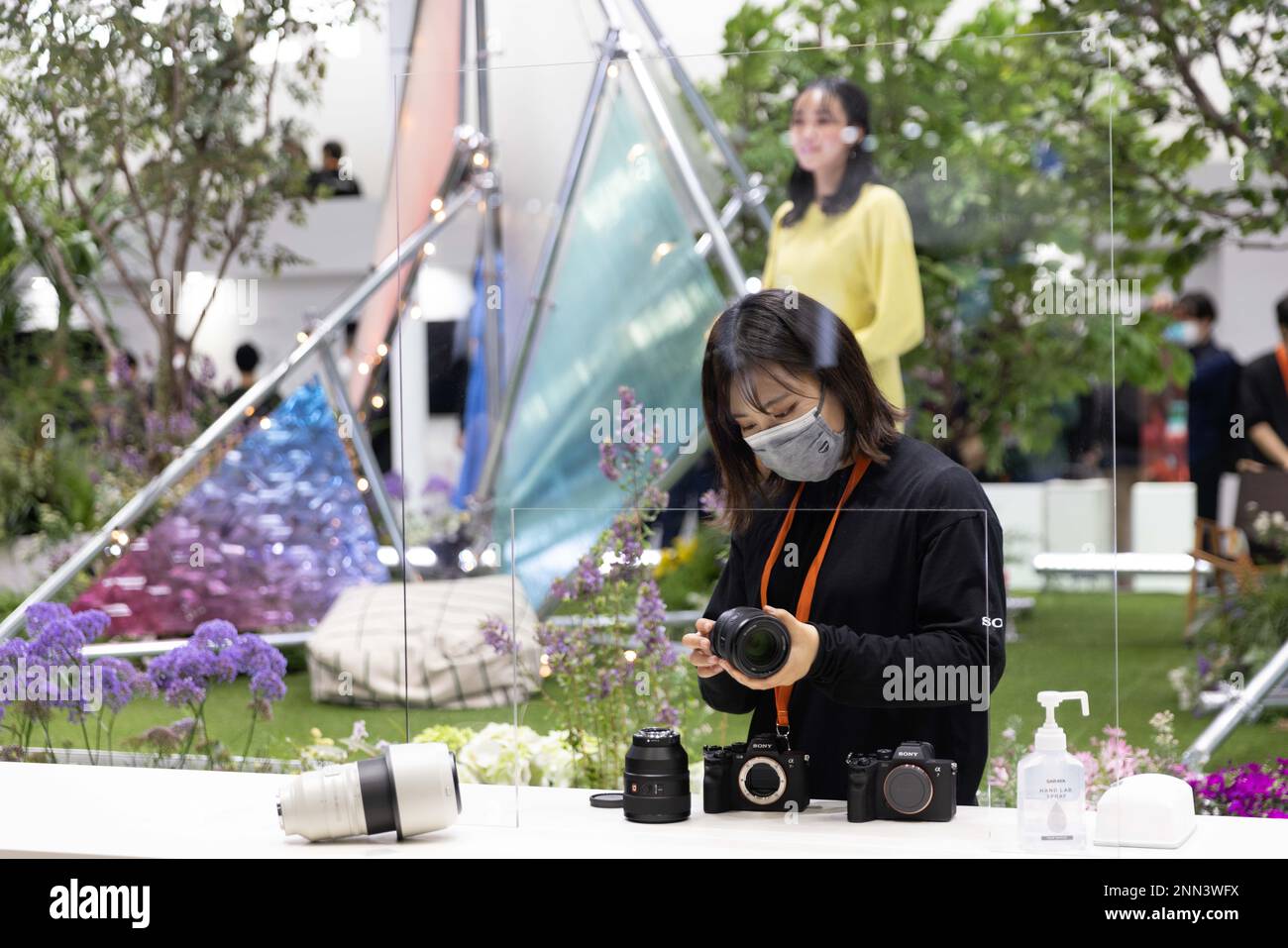 Yokohama, Japan. 24th Feb, 2023. SONY exhibitor cleans lenses at the ...