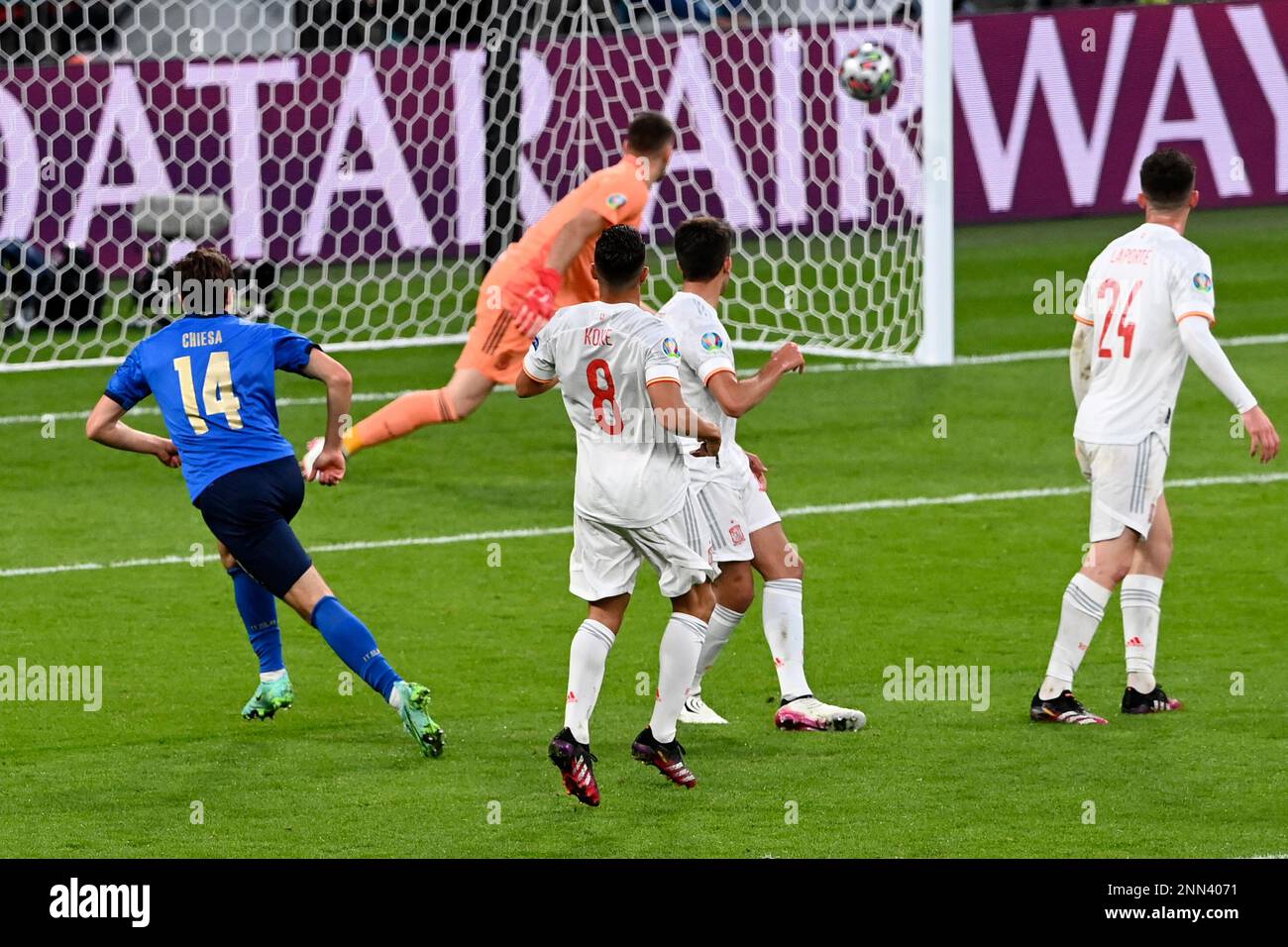 Italy's Federico Chiesa, left, scores the opening goal during the Euro ...