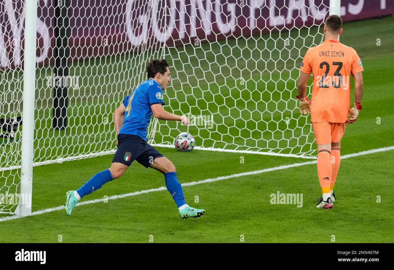 Italy's Federico Chiesa, left, reacts after scoring his team's first ...