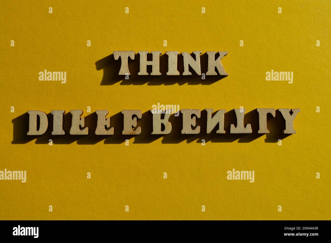 Think Differently, words in wooden alphabet letters with some letters ...