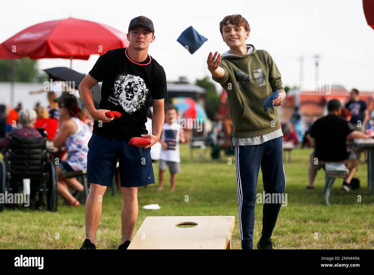 Layne Arthurs, left, and Damien Hurst plays cornhole at the River West ...