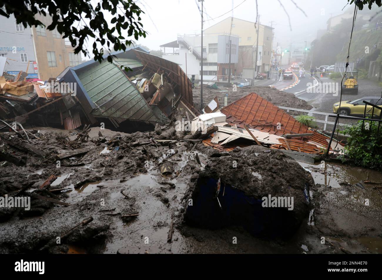 Housese are swamped with a mudslide at Izuyama district, Atami ...
