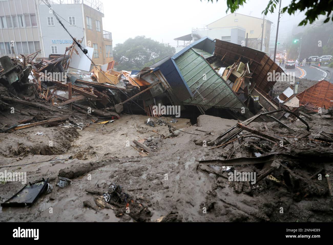 Housese are swamped with a mudslide at Izuyama district, Atami ...