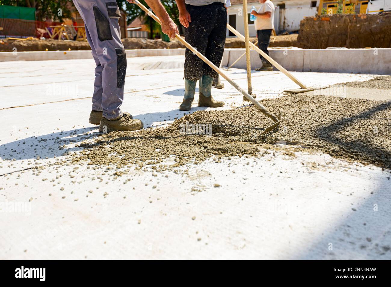 Construction workers, riggers are using rake and wooden handmade ...