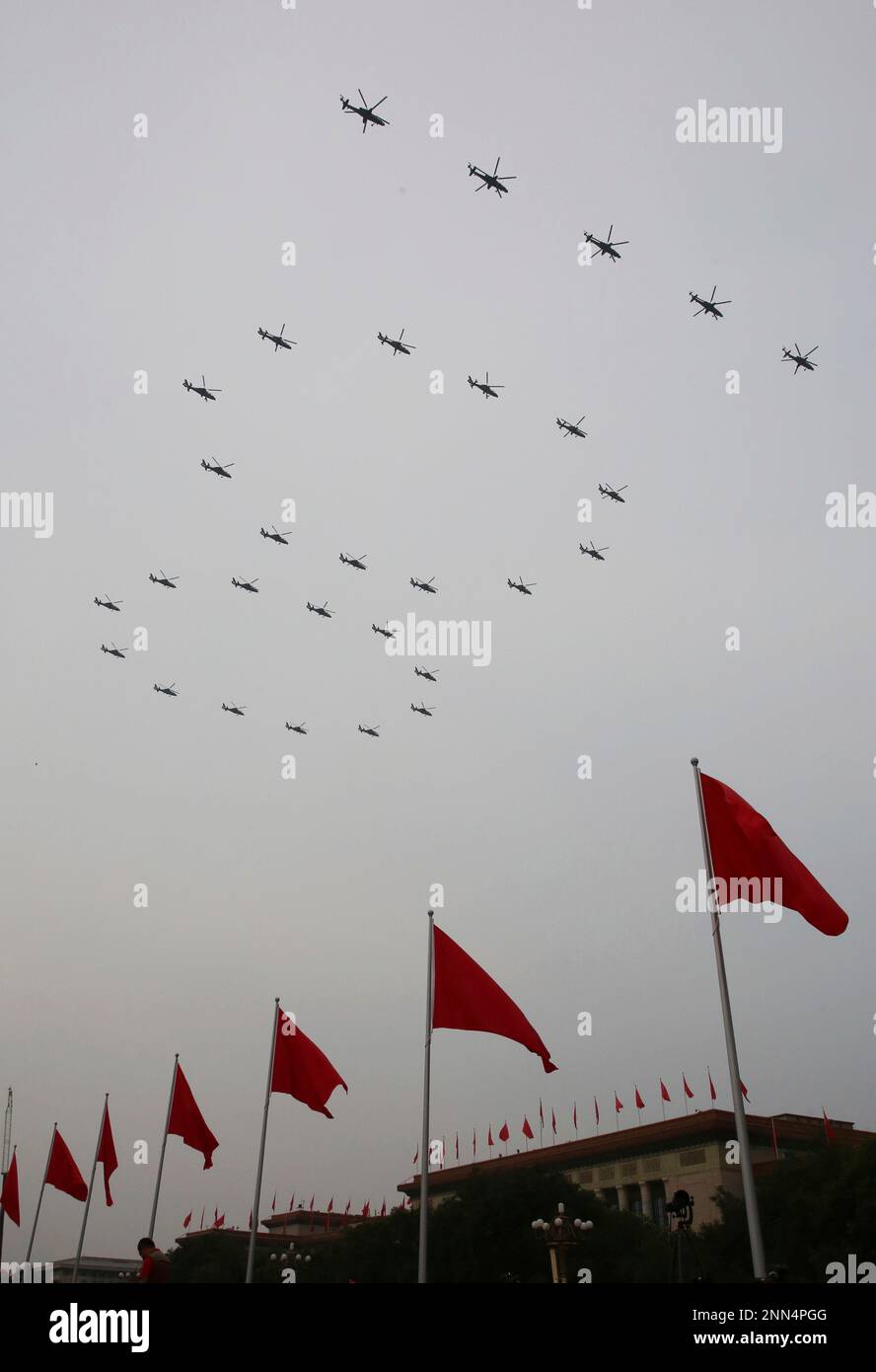 Helicopters fly over Tiananmen Square in the shape of "100" during a ...