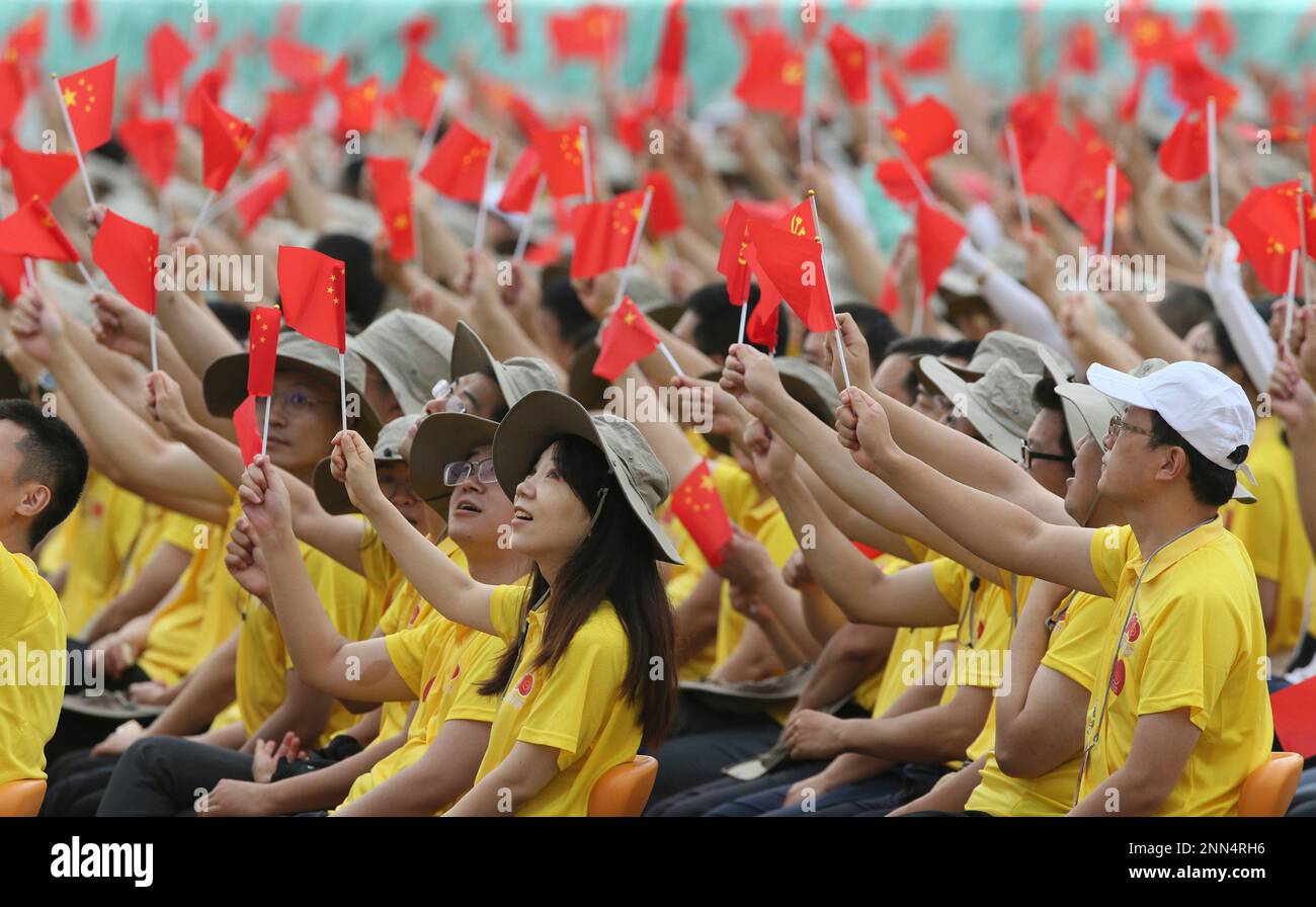 People attend a ceremony to commemorate the 100th anniversary of the ...