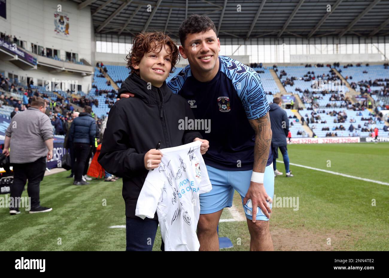 Coventry City's Gustavo Hamer poses for a picture with a fan before the ...