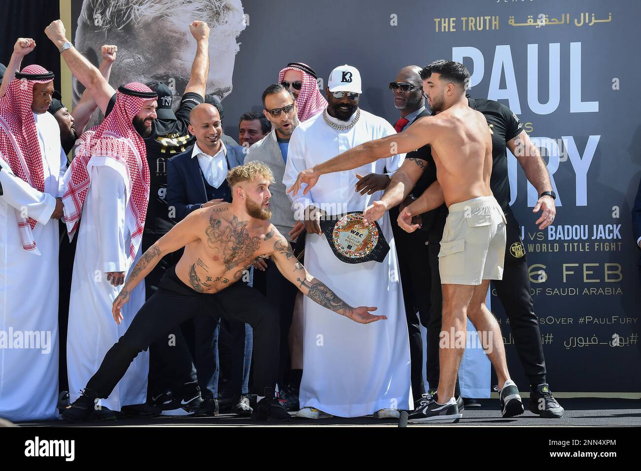 Jake Paul, left, and Tommy Fury, face off after a weigh-in, a day ...