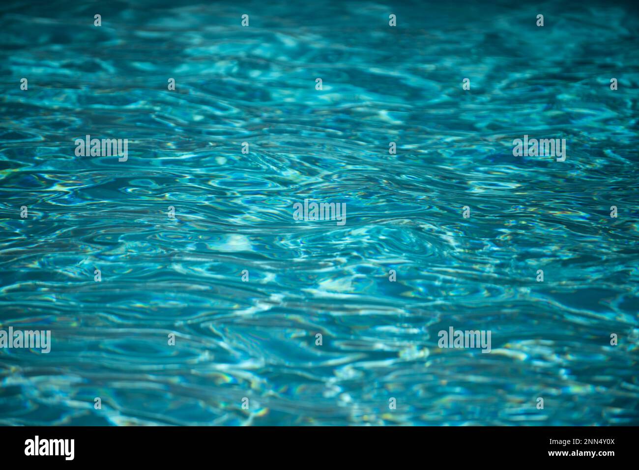 Water in swimming pool, background with high resolution. Wave abstract or rippled water texture ...