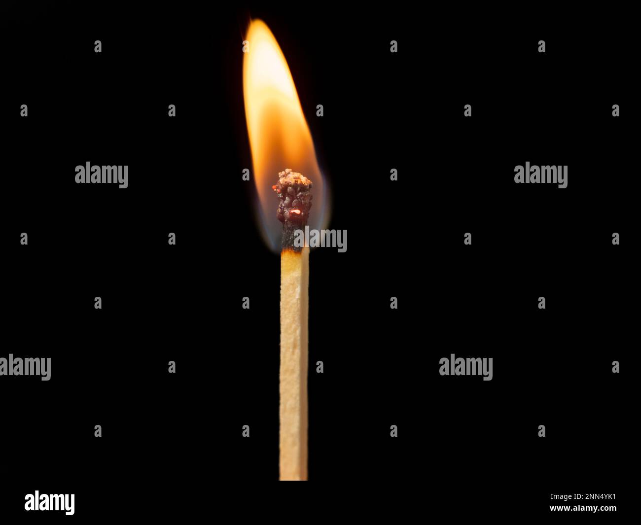 Burning match on a black background. Flame from a lit match. Close-up ...