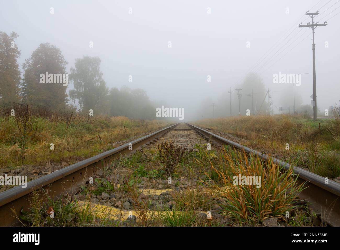 Railway line in the fog Stock Photo - Alamy