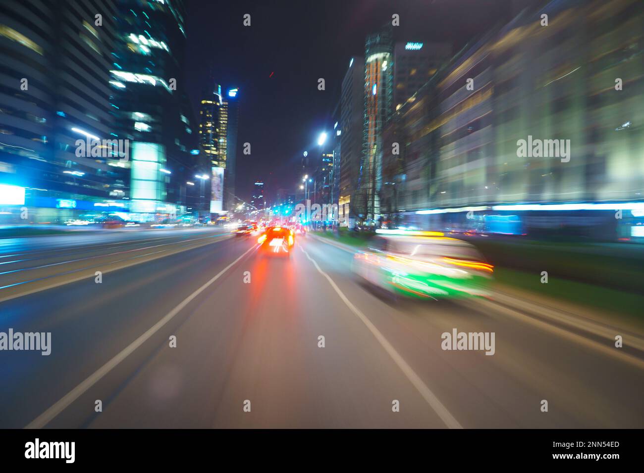 Driving through the city at night, motion blur Stock Photo - Alamy