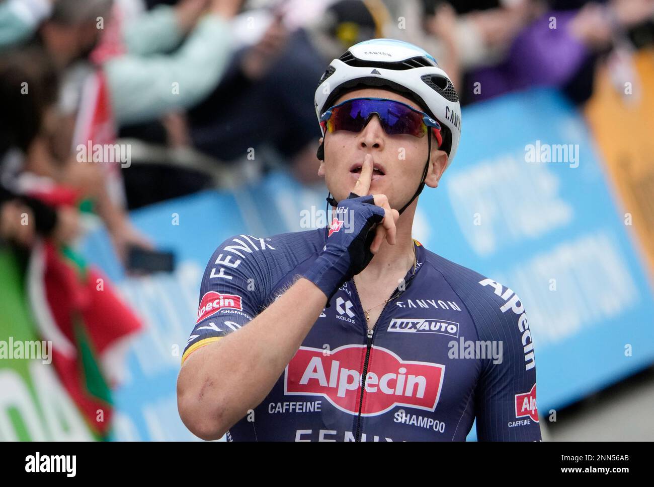Belgium's Tim Merlier celebrates as he crosses the finish line to win ...