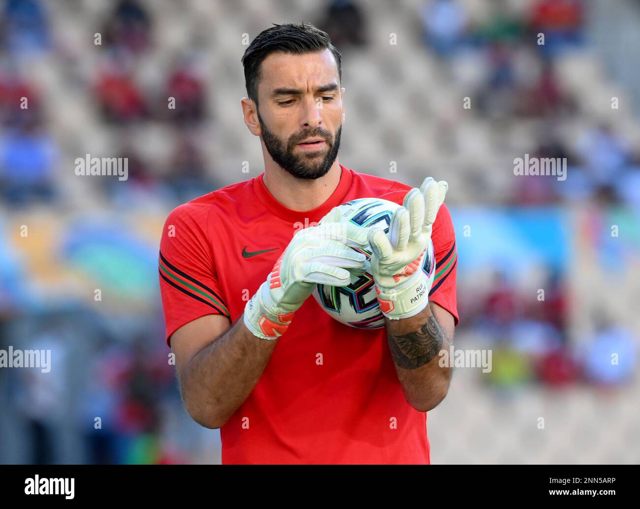 Portugal's goalkeeper Rui Patricio adjusts his gloves ahead of the Euro ...