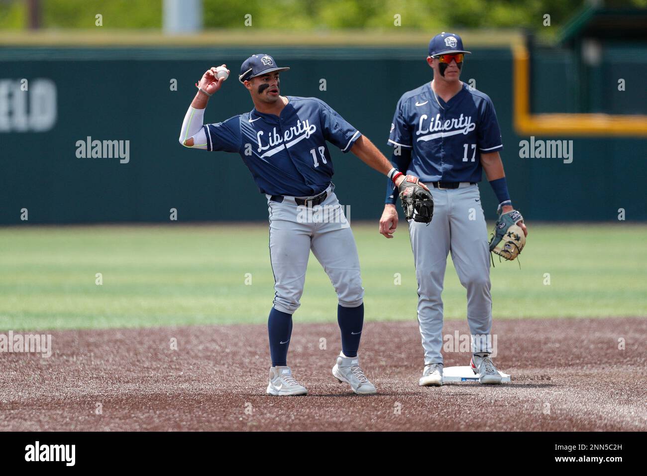 Liberty Flames shortstop Cam Locklear (18) on defense against the Duke ...