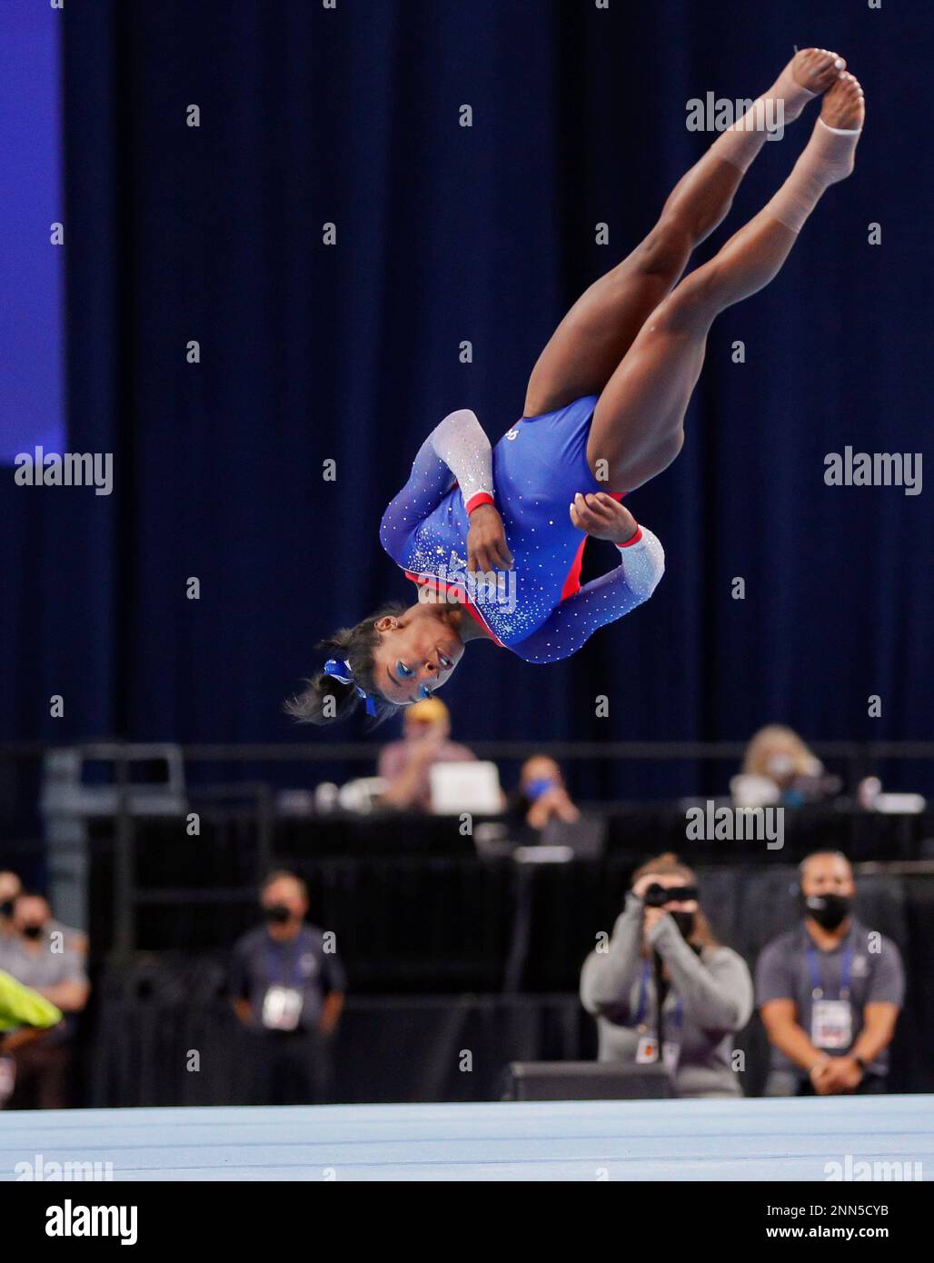 June 25, 2021: Simone Biles twists in the air during her floor routine ...