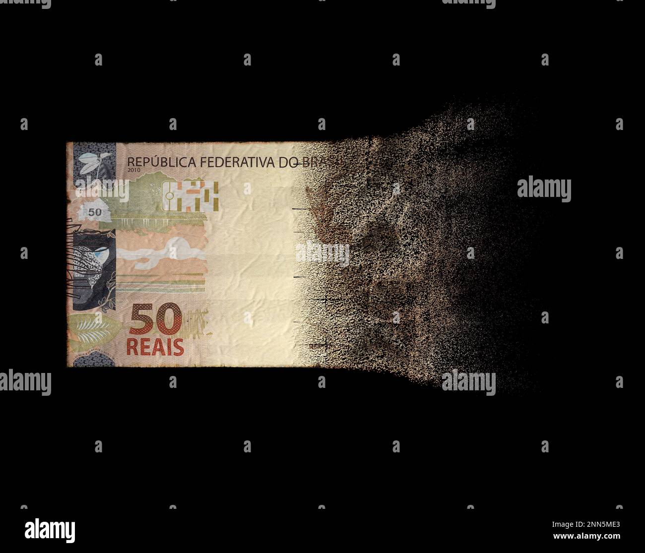 A concept image showing a half dissolved flat paper brazilian real bank ...